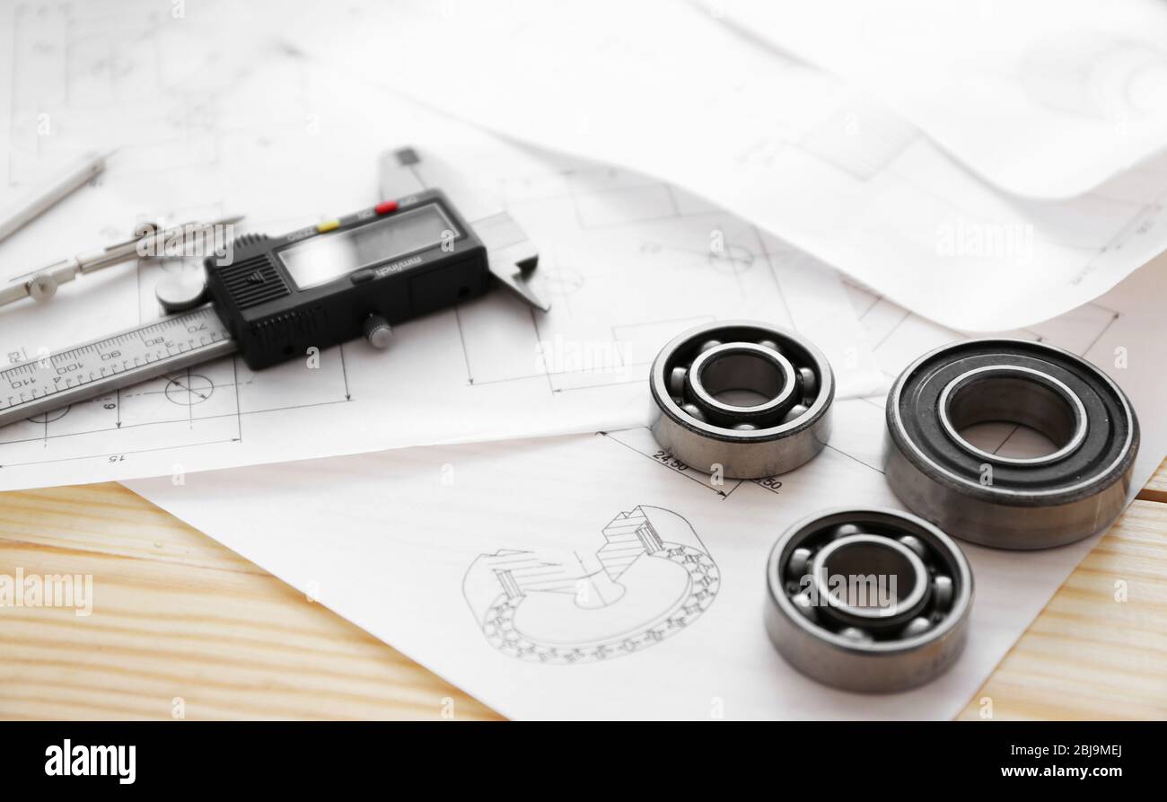 Engineering drawings of parts with tools closeup Stock Photo - Alamy