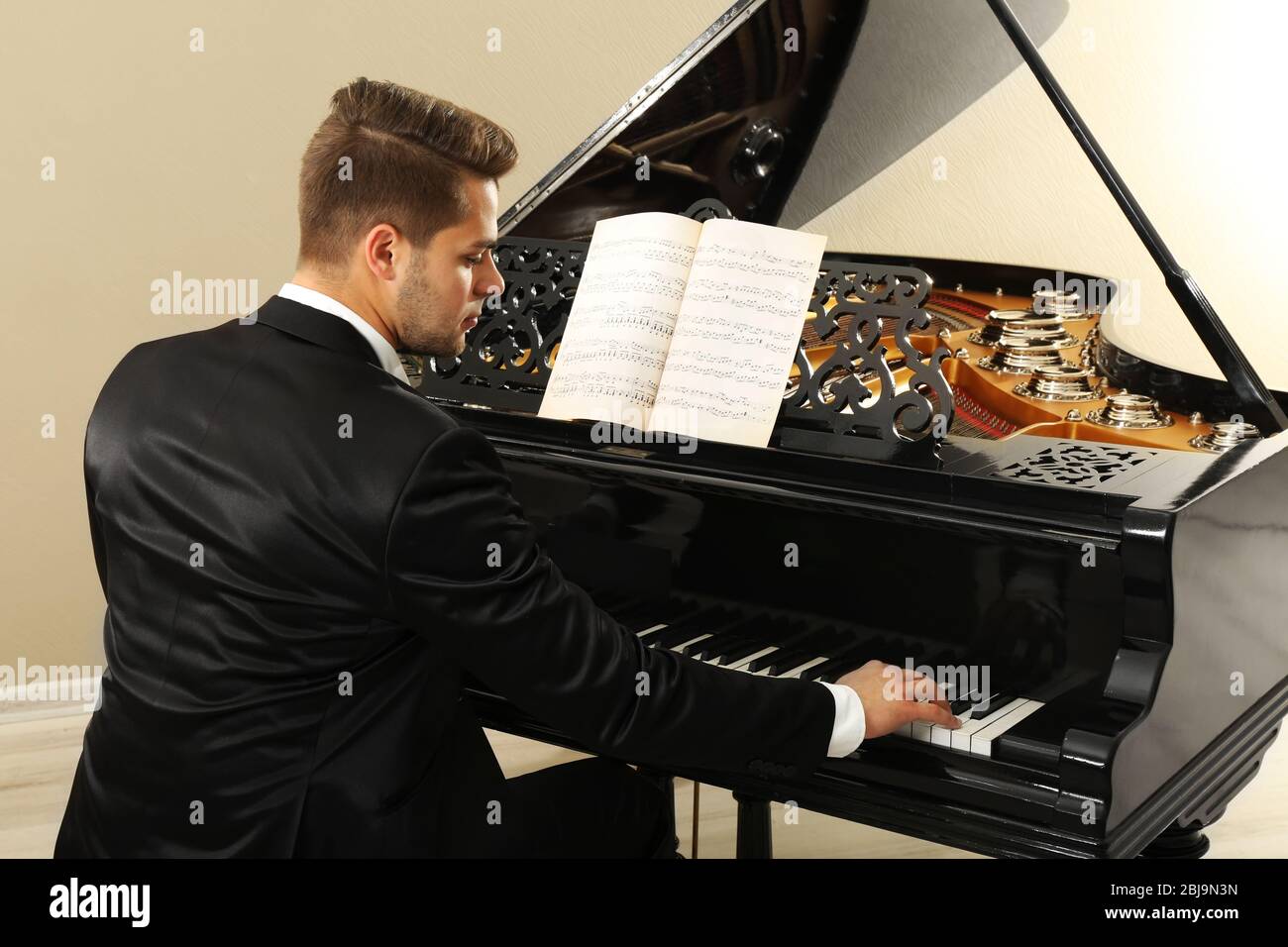 Musician playing piano Stock Photo - Alamy