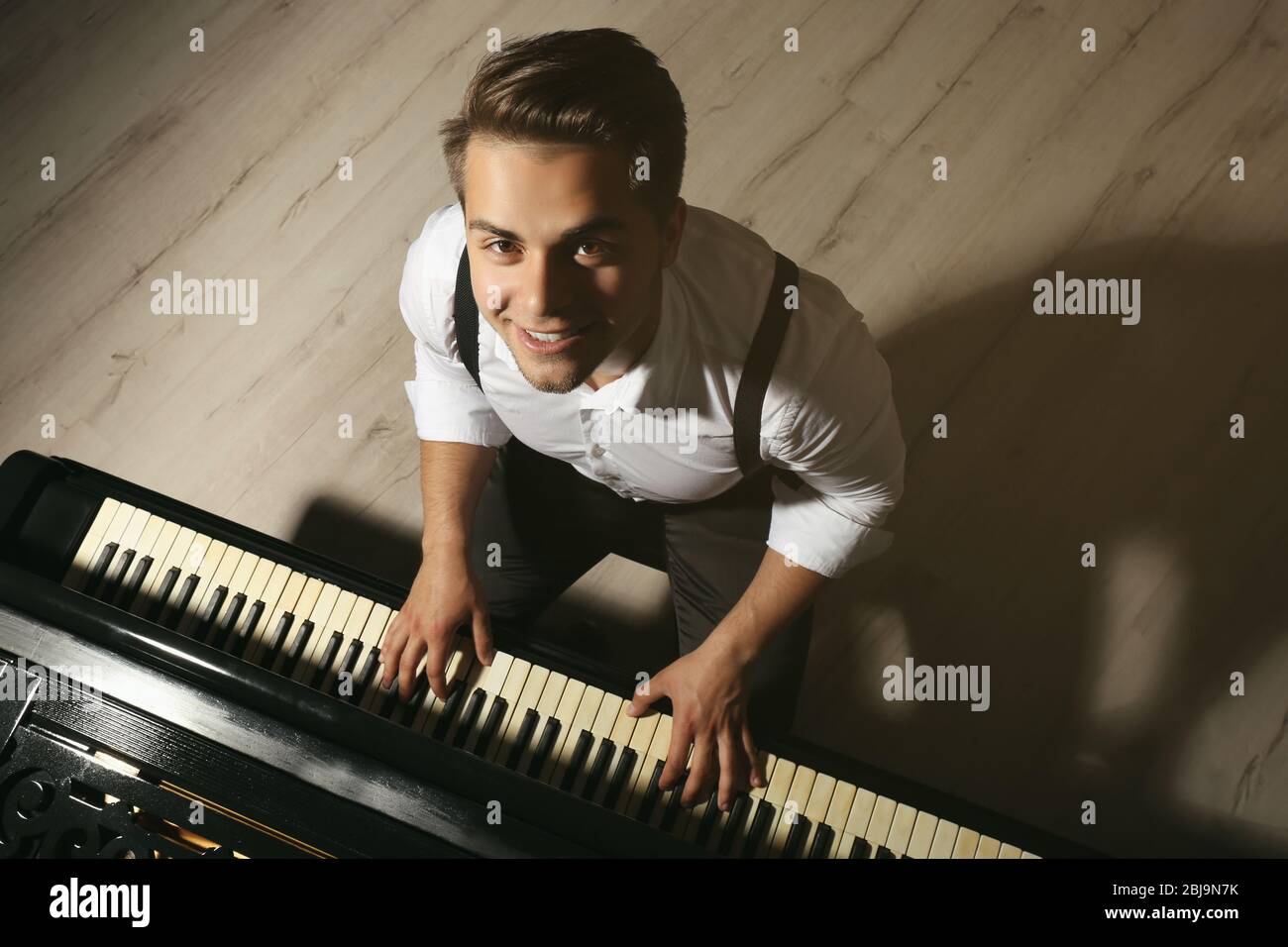 Man plays white piano male hi-res stock photography and images - Alamy