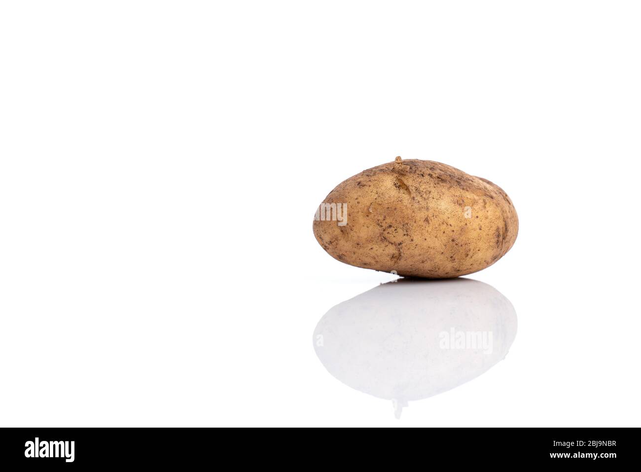 Unpeeled raw fresh potato, isolated on white background Stock Photo - Alamy