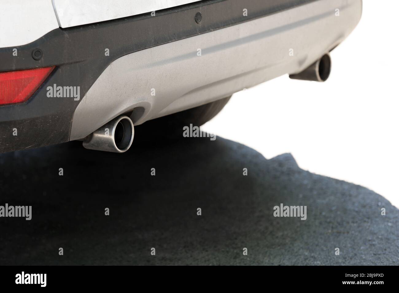 Exhaust pipe and back part of a car Stock Photo - Alamy