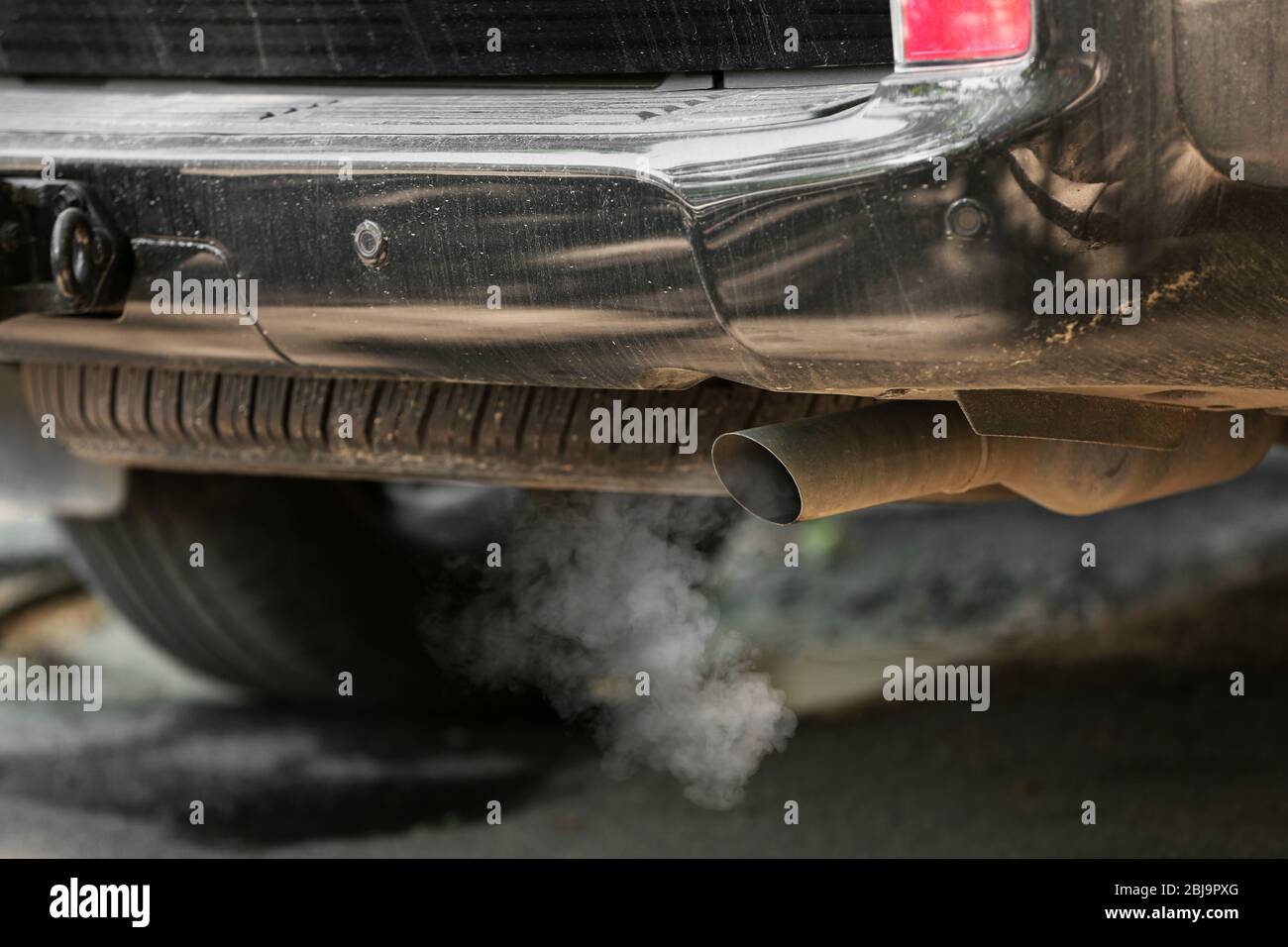 Combustion gas from car exhaust pipe, closeup Stock Photo - Alamy