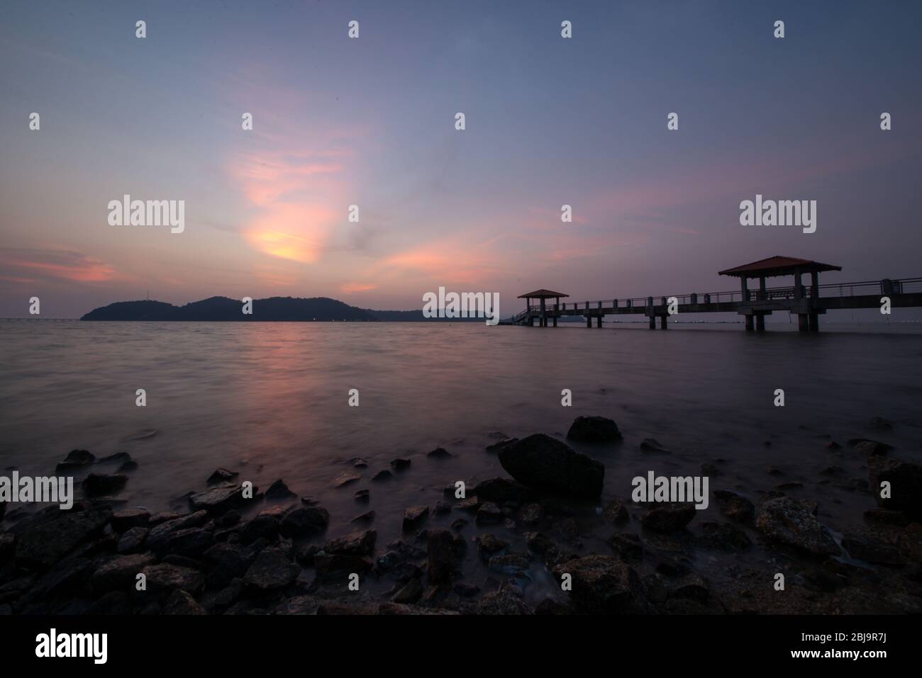 Bridge at Jetty Batu Musang during sunset moment Stock Photo - Alamy
