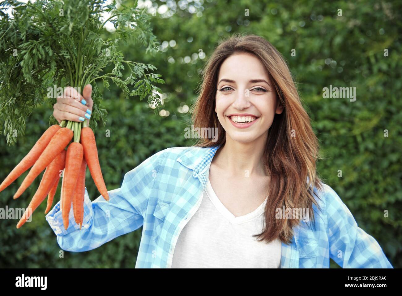 Girl eating carrot hi-res stock photography and images - Alamy