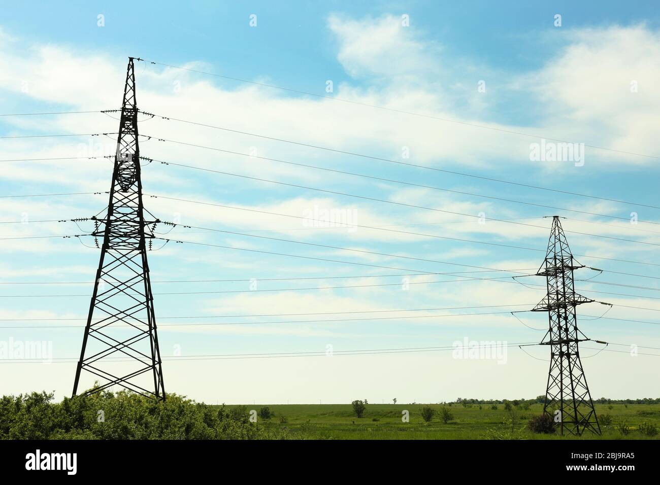 High voltage tower in field Stock Photo - Alamy