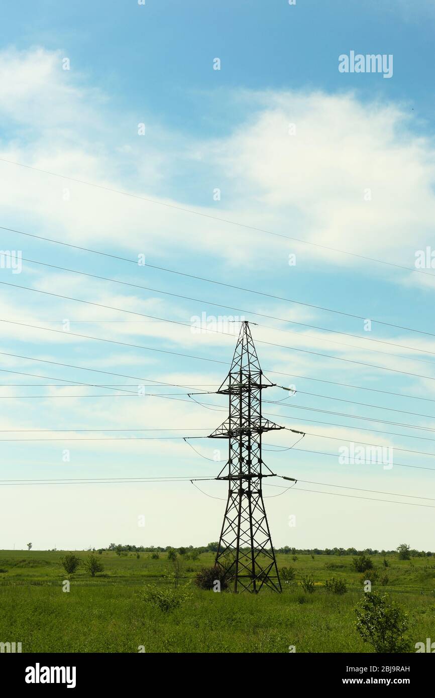 High voltage tower in field Stock Photo - Alamy