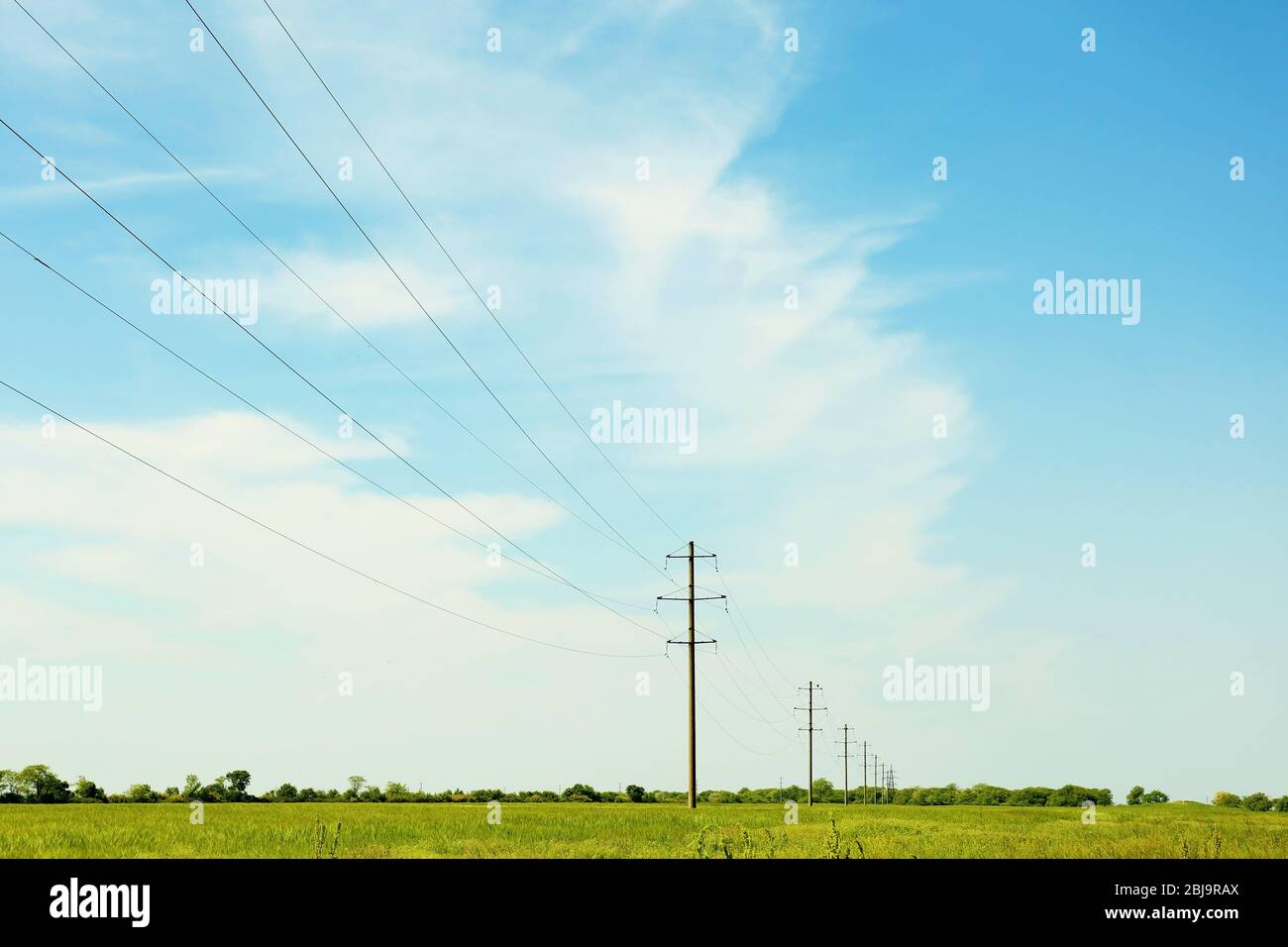 High voltage tower in field Stock Photo - Alamy
