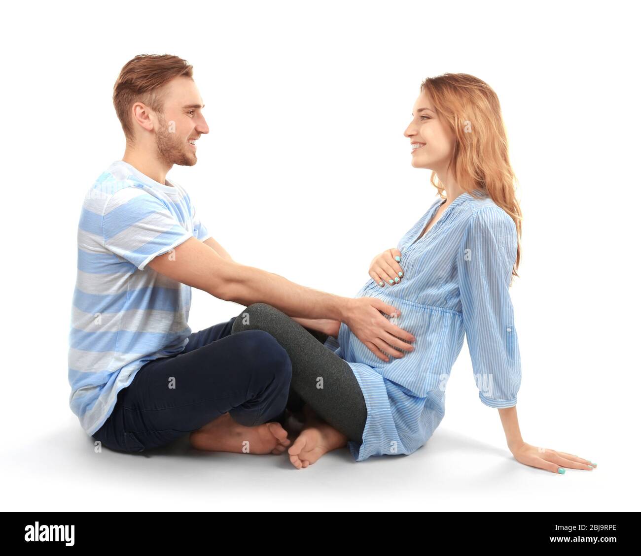 Happy family expecting baby isolated on white Stock Photo - Alamy