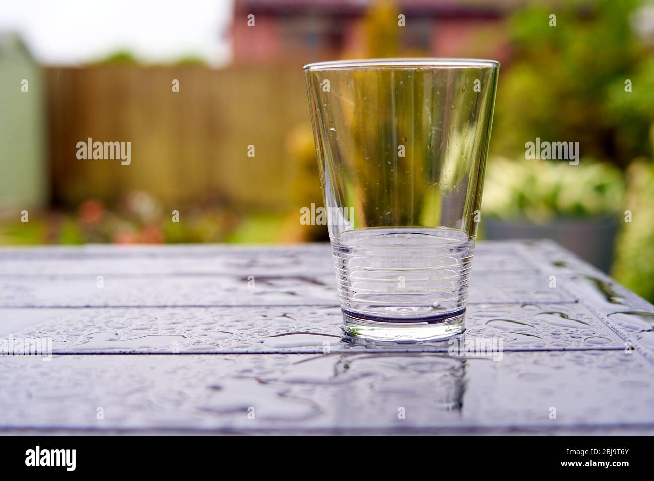 Garden furniture after heavy rain, UK, 2020 Stock Photo - Alamy