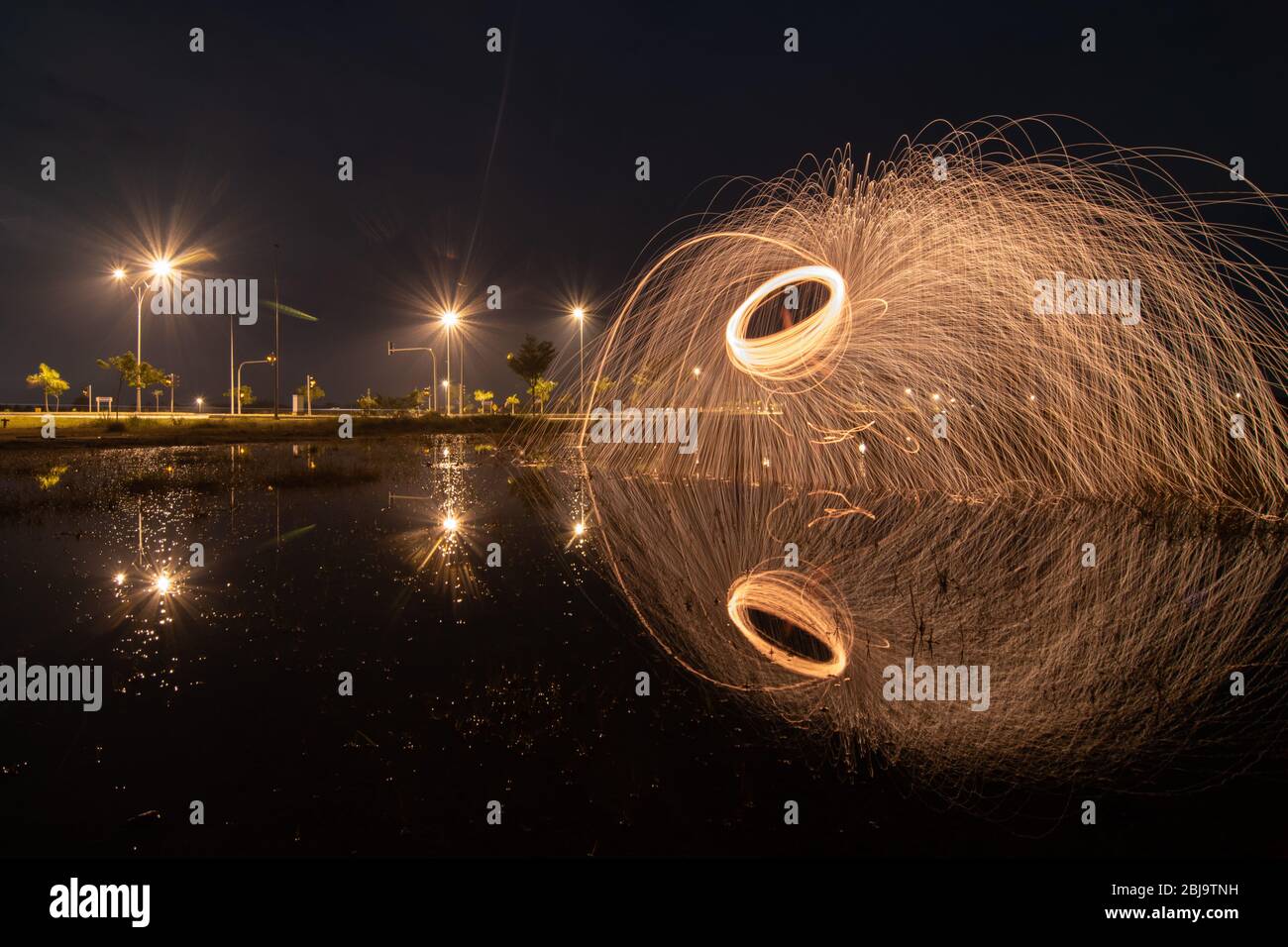 Reflection of steel wool in water Stock Photo - Alamy