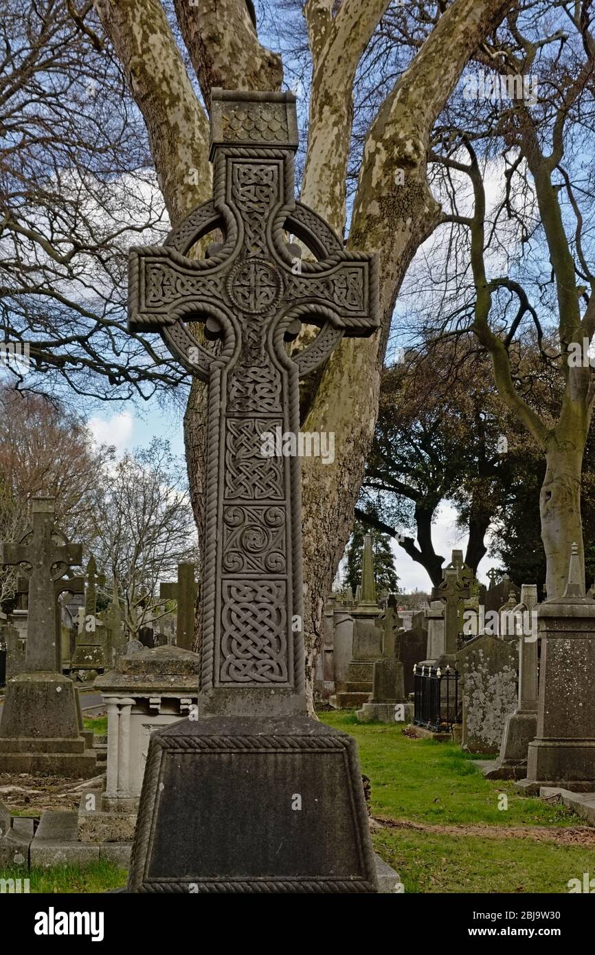 historic grave monument with celtic cross in Glasnevin cemetery, Dublin ...