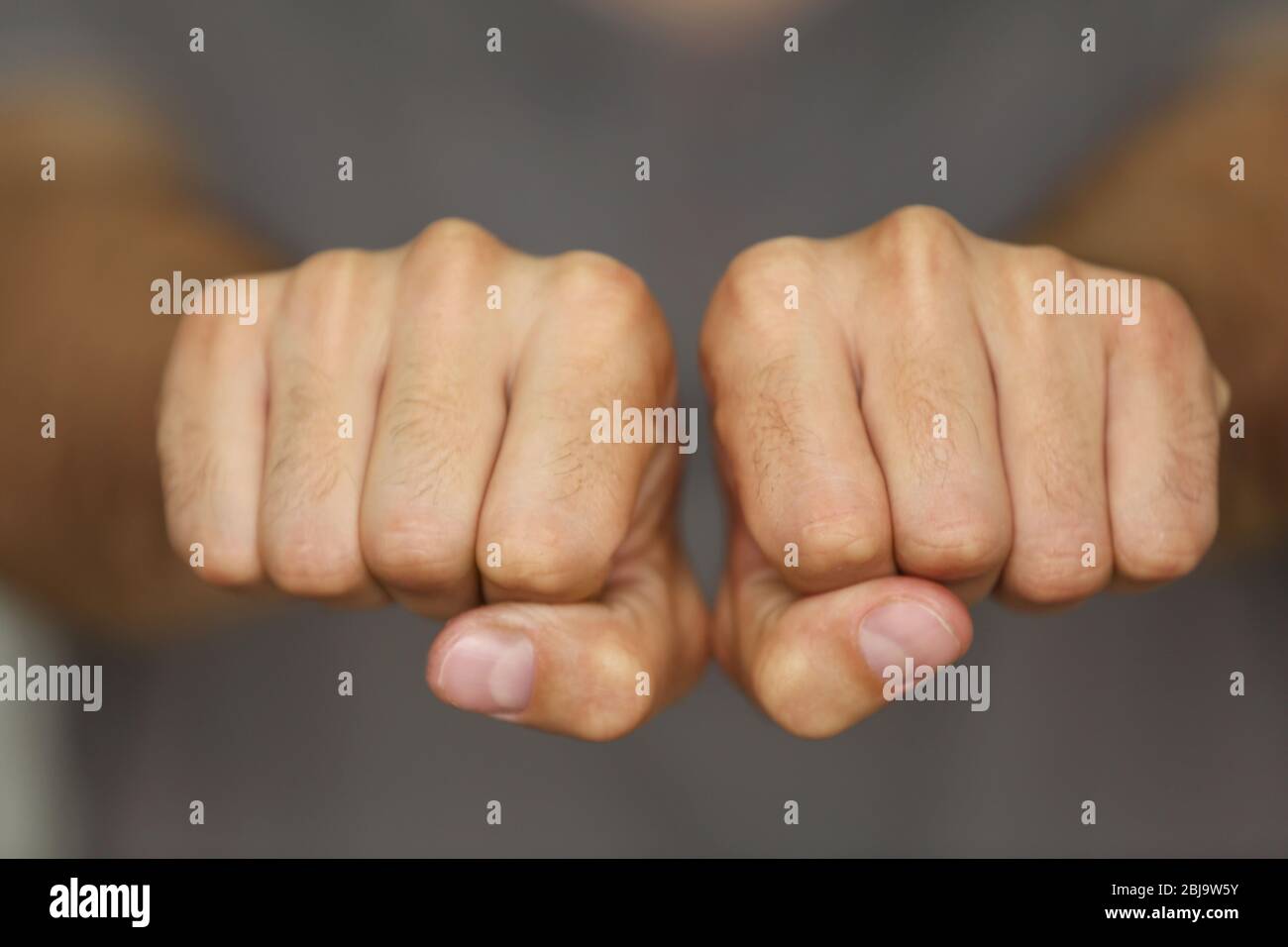 Man fists with space for tattoo Stock Photo - Alamy