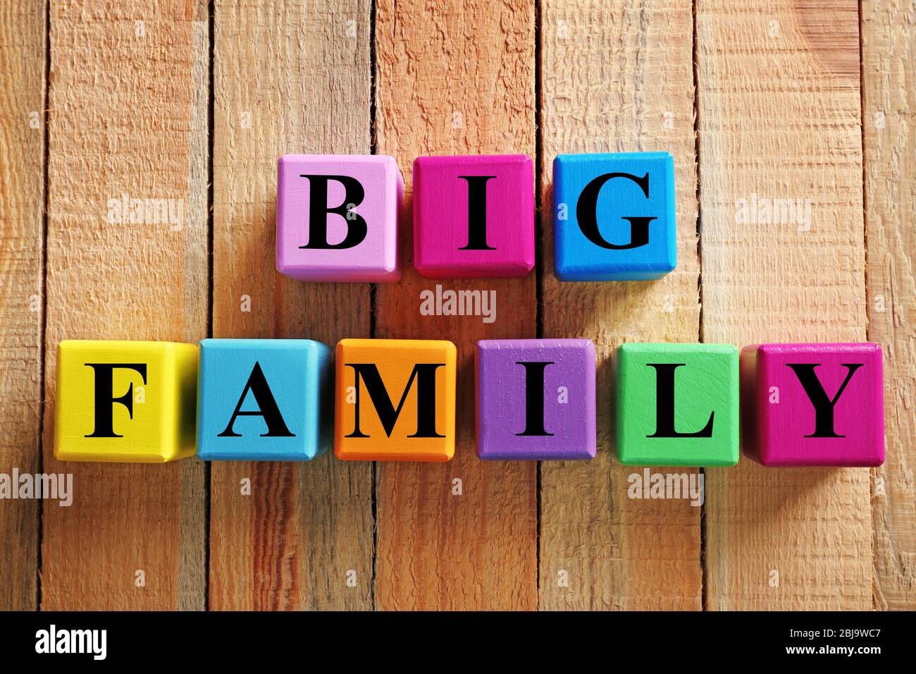 Color words BIG FAMILY on wooden background Stock Photo - Alamy