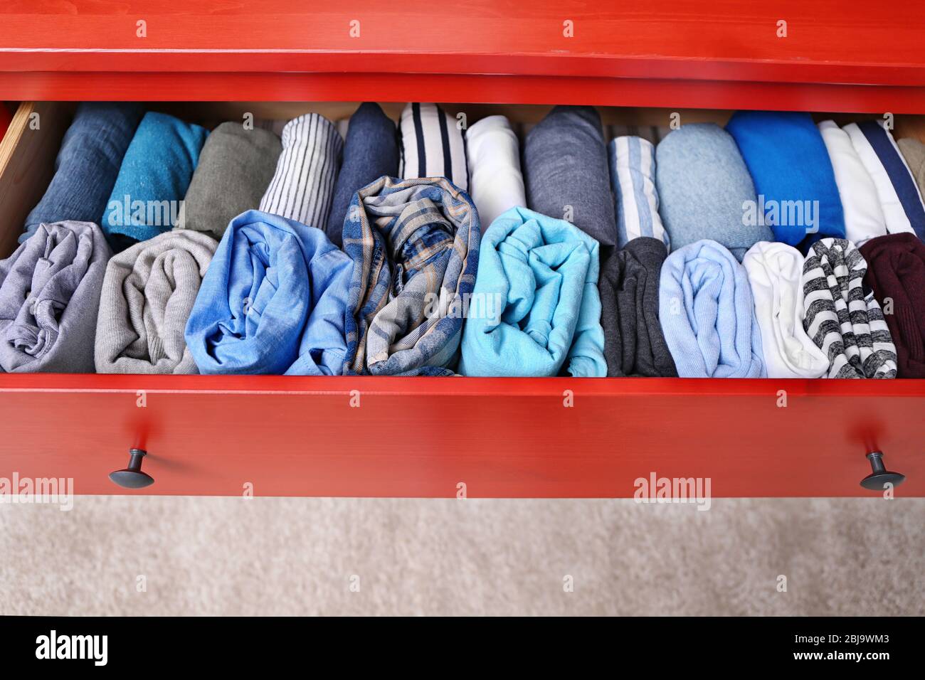 Neatly folded clothes hi-res stock photography and images - Alamy
