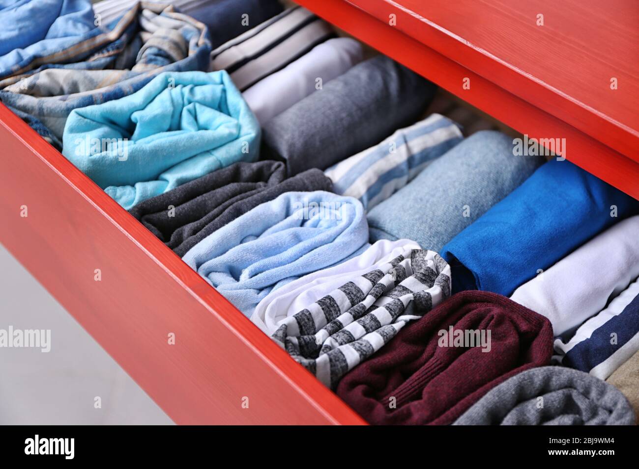 Neatly folded clothes hi-res stock photography and images - Alamy