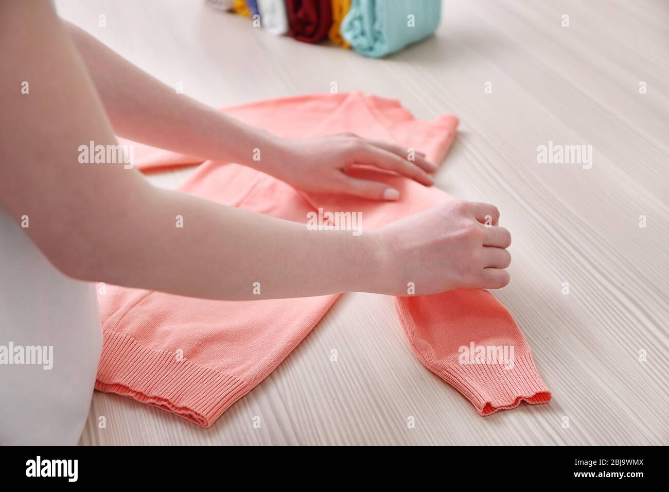 Female hands gently folding hi-res stock photography and images - Alamy