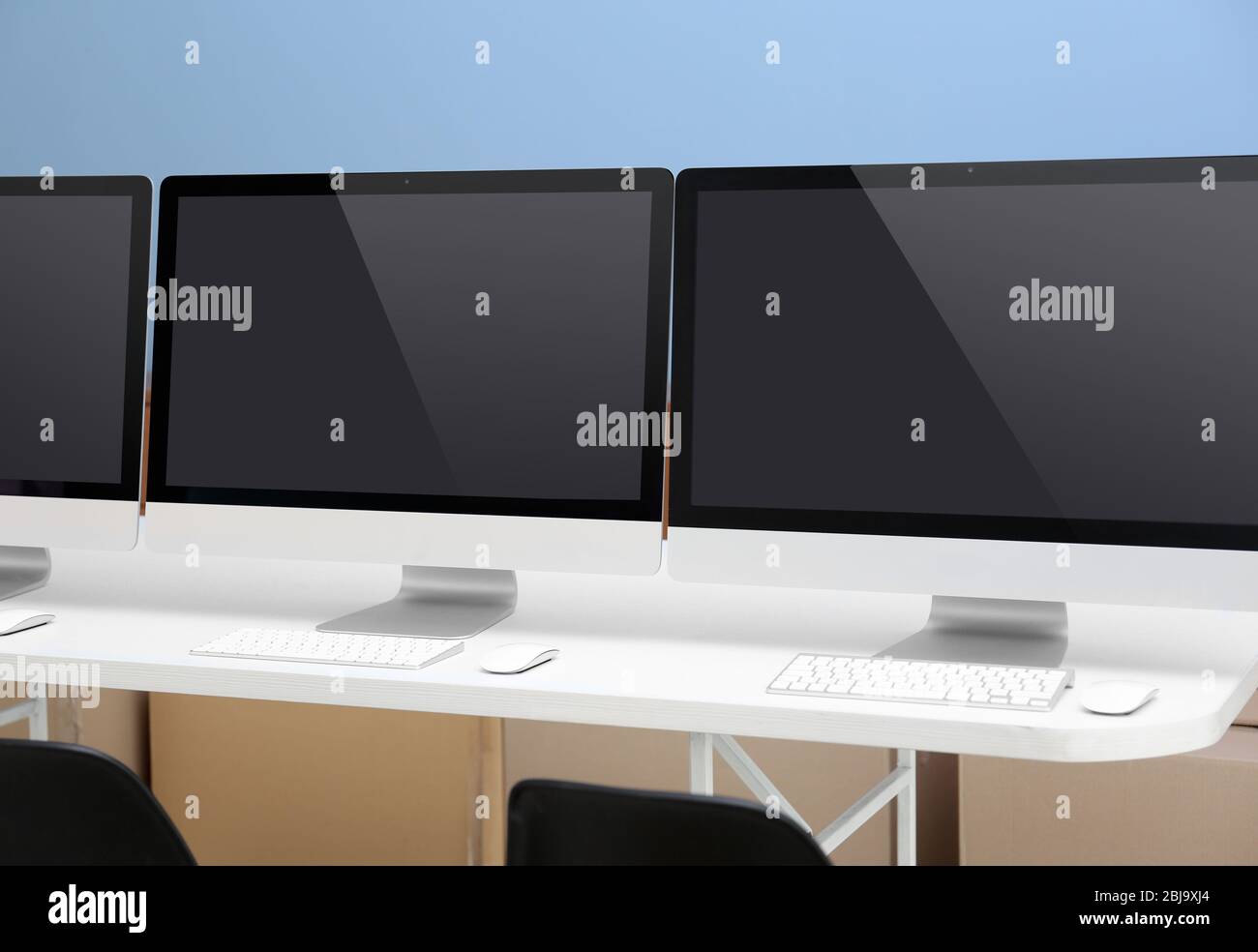 Row of computers in office Stock Photo - Alamy