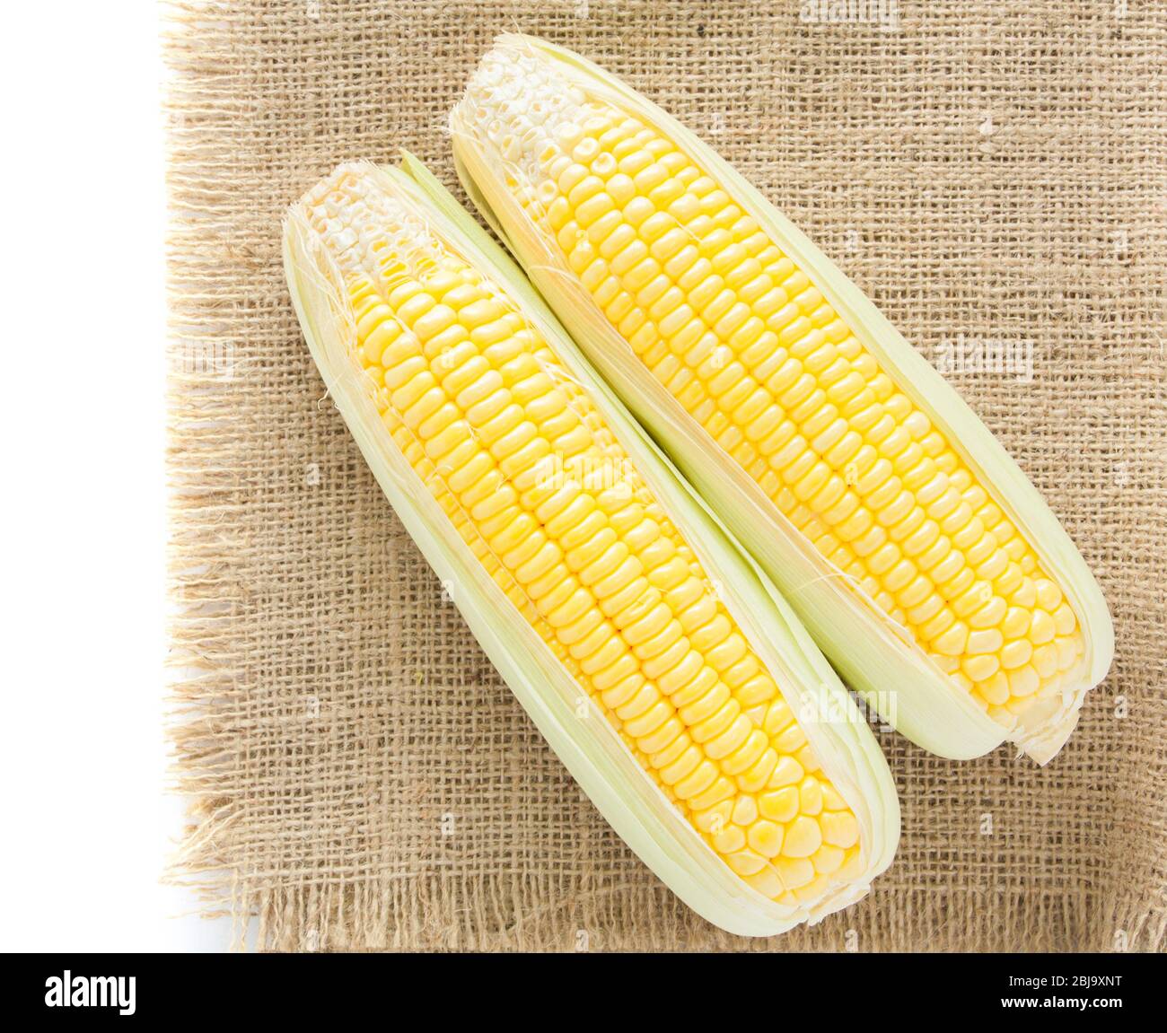 two corn on sack background Stock Photo - Alamy