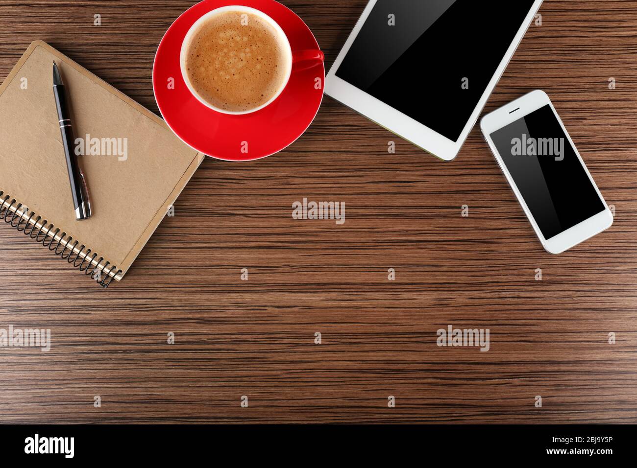 Top view of office desk with coffee and accessories Stock Photo - Alamy