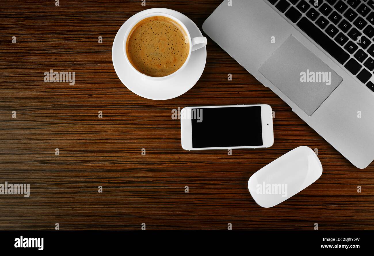 Top view of office desk with coffee and accessories Stock Photo - Alamy