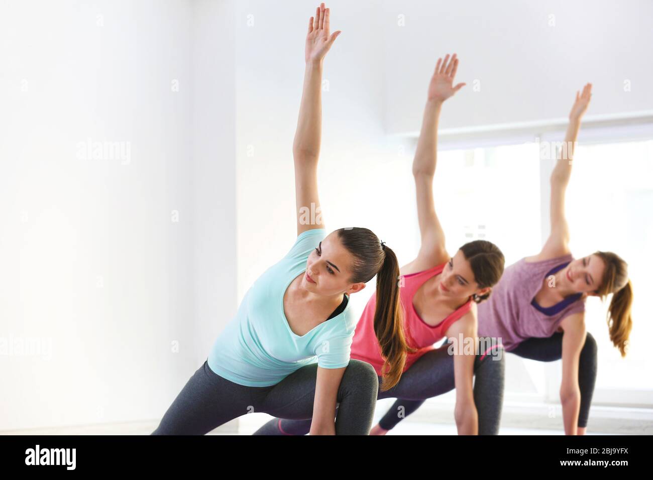 Young women doing exercise in gym Stock Photo - Alamy
