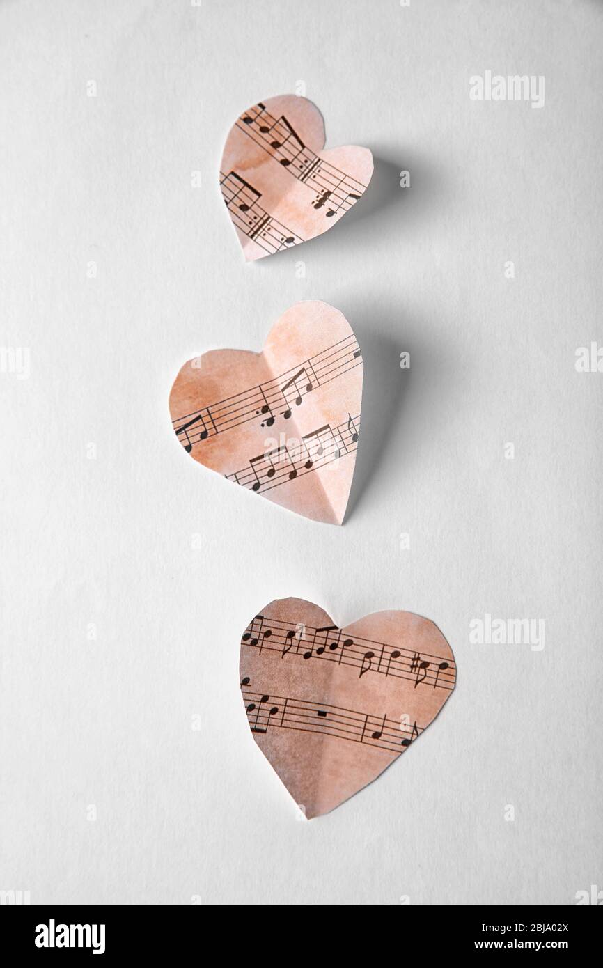 Paper hearts with music notes on white background Stock Photo - Alamy