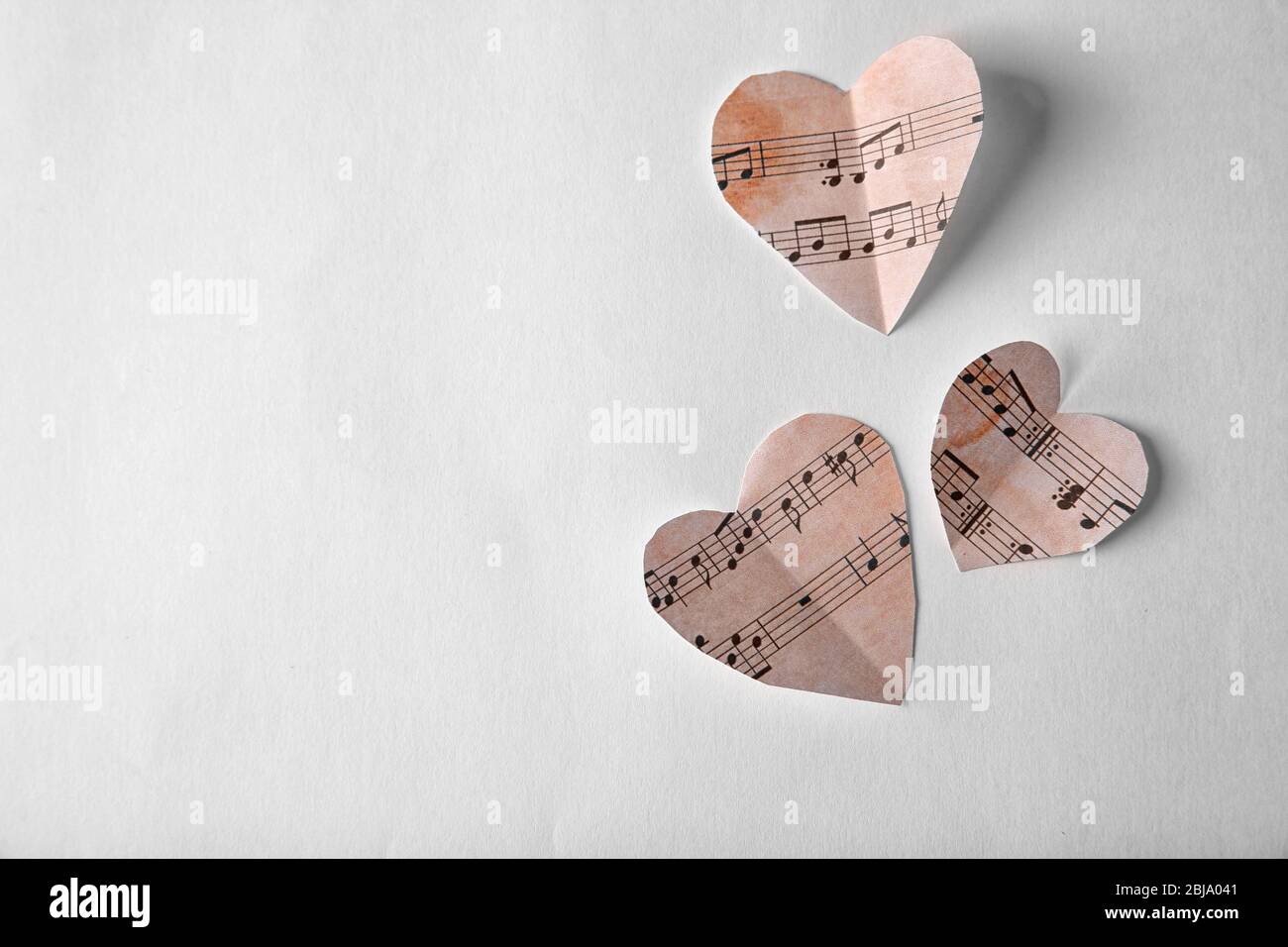 Paper hearts with music notes on white background Stock Photo - Alamy