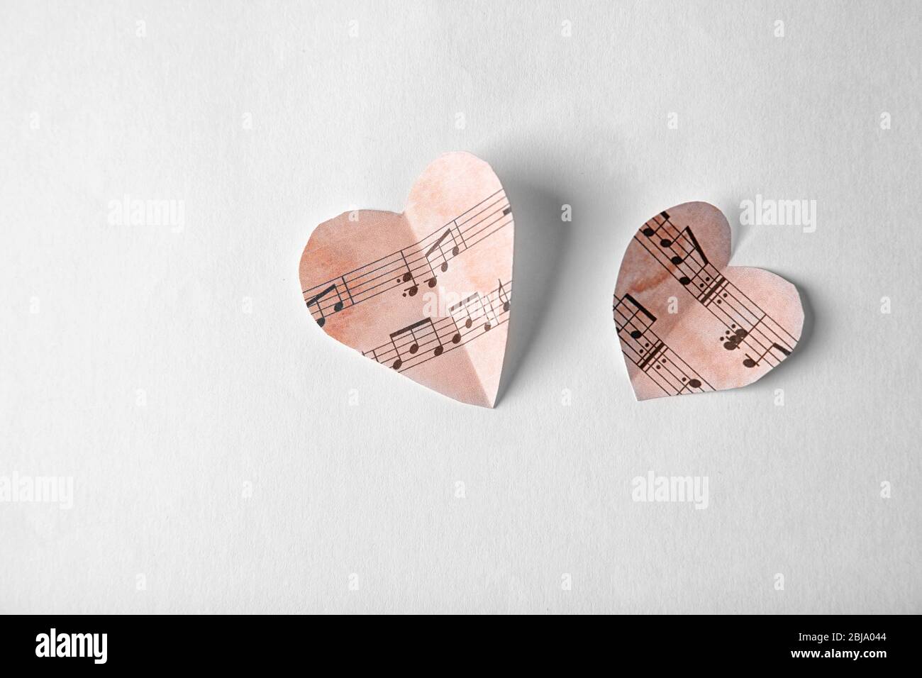 Paper hearts with music notes on white background Stock Photo - Alamy