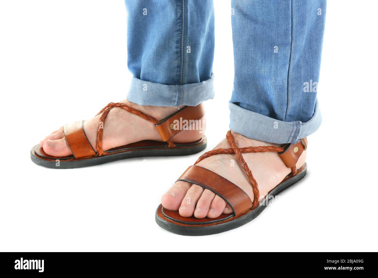 Brown leather sandals on man's feet isolated on white Stock Photo - Alamy