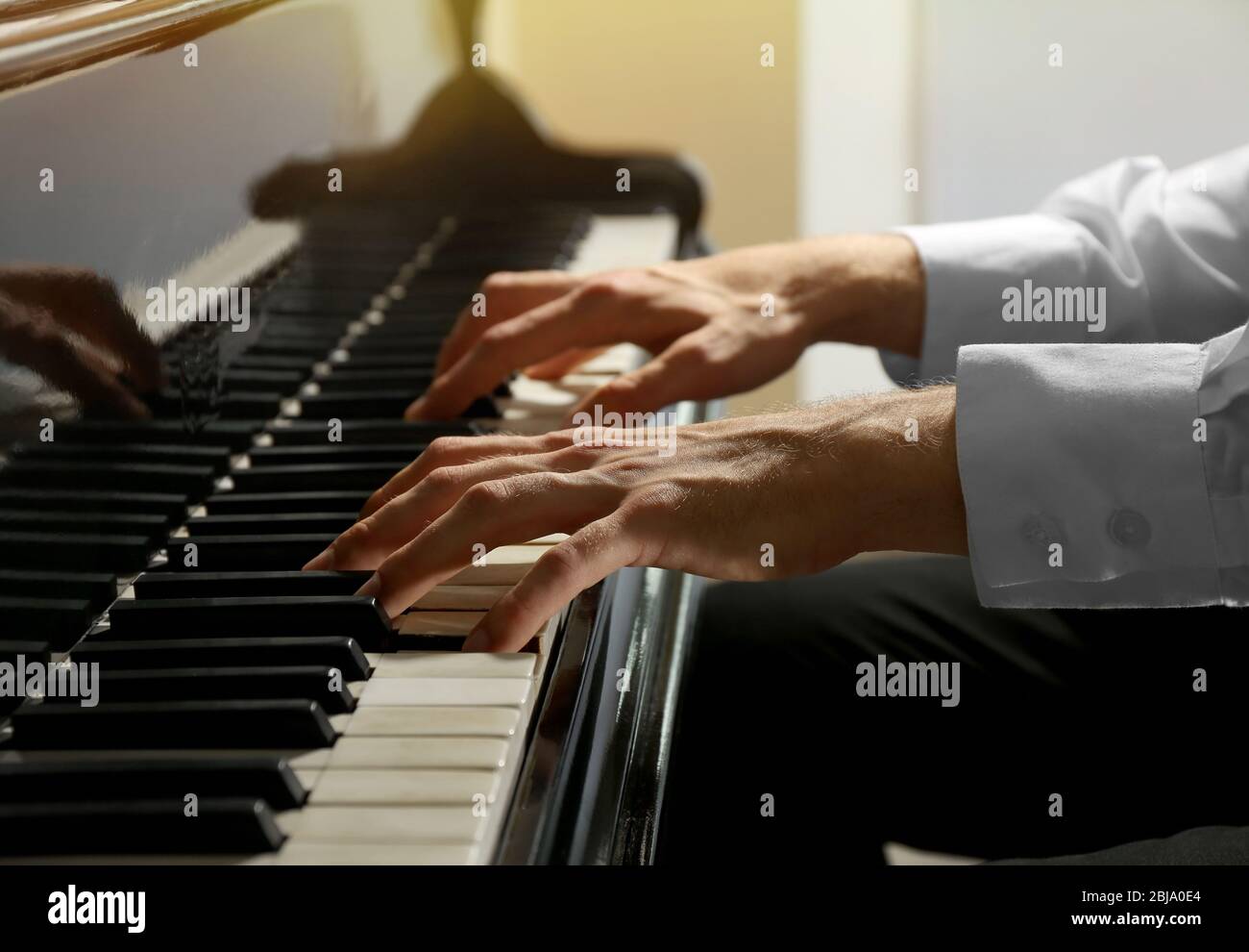 Man hands playing piano hi-res stock photography and images - Alamy