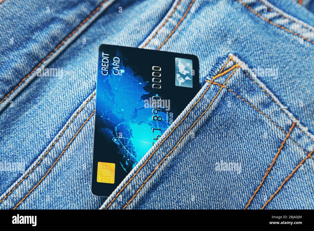 Credit card in pocket Stock Photo - Alamy