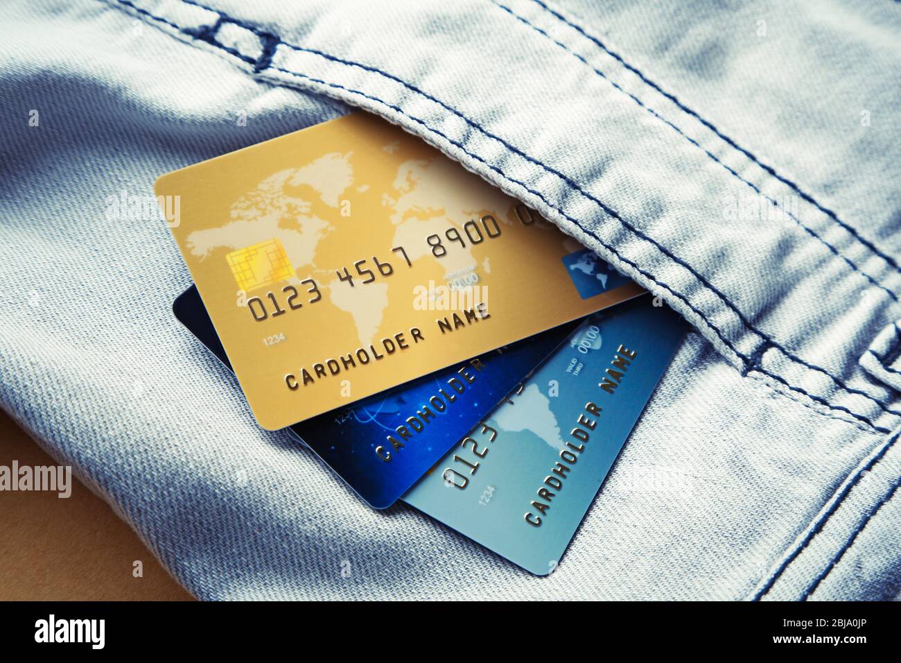 Credit cards in pocket Stock Photo - Alamy