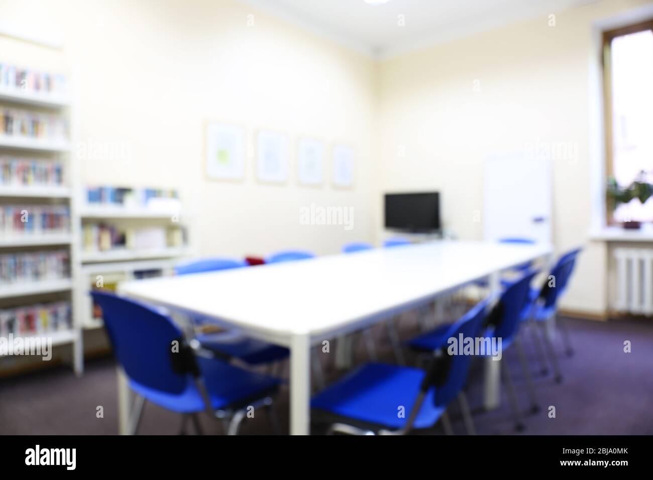Modern library interior with blue chairs Stock Photo - Alamy