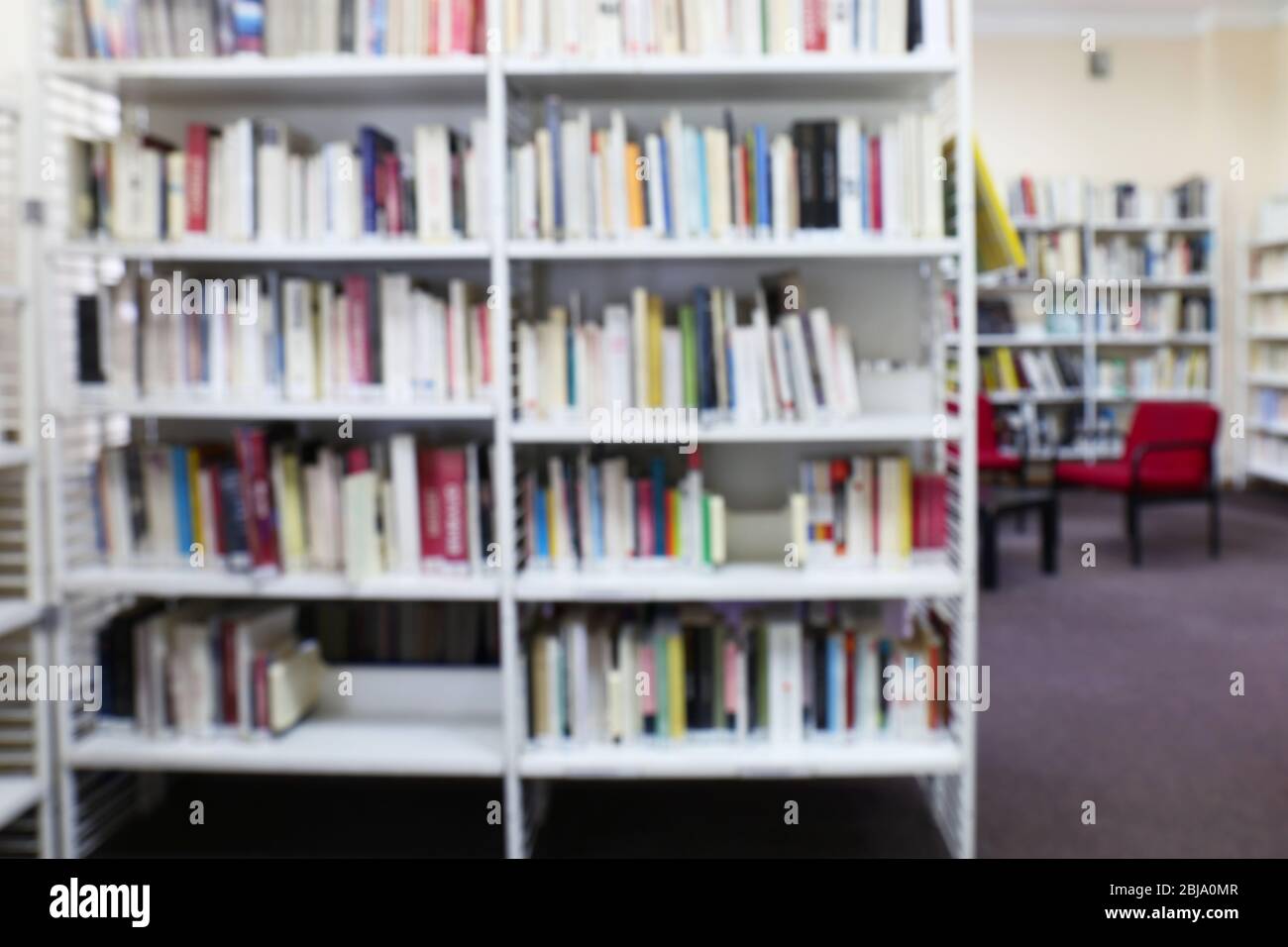 Modern library. Bookshelves full of books Stock Photo - Alamy