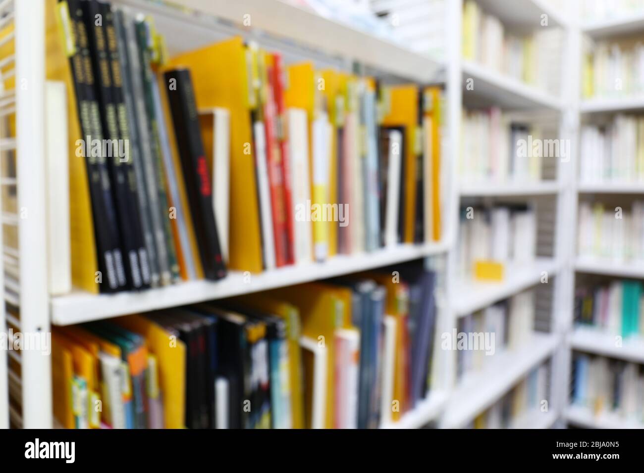 Modern library. Bookshelves full of books Stock Photo - Alamy