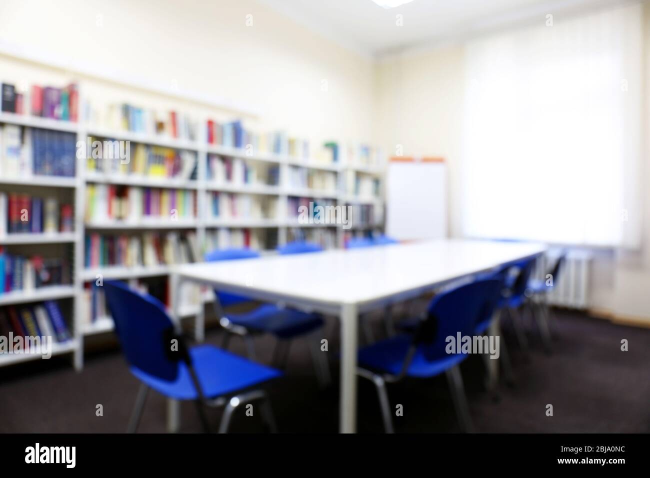 Modern library interior with blue chairs Stock Photo - Alamy