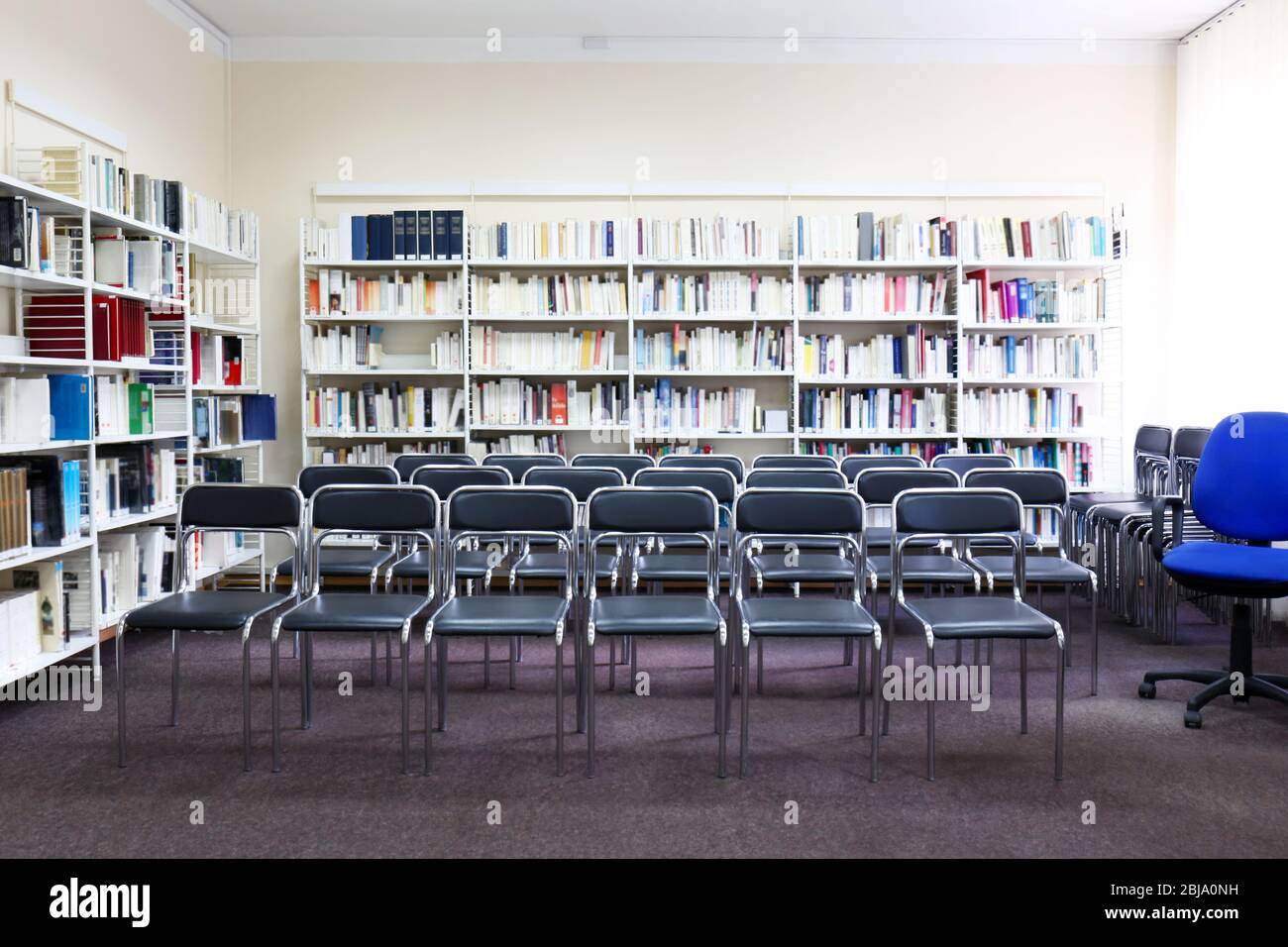 Modern library interior with chairs Stock Photo - Alamy