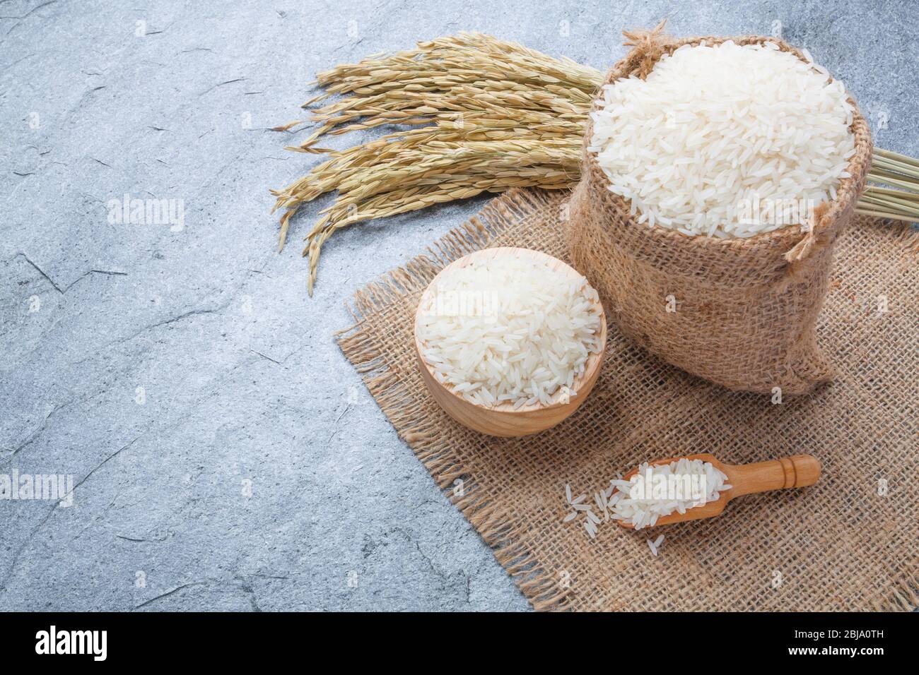 thai fragrant jasmine rice in a bowl with gold spike on Sack Stock ...