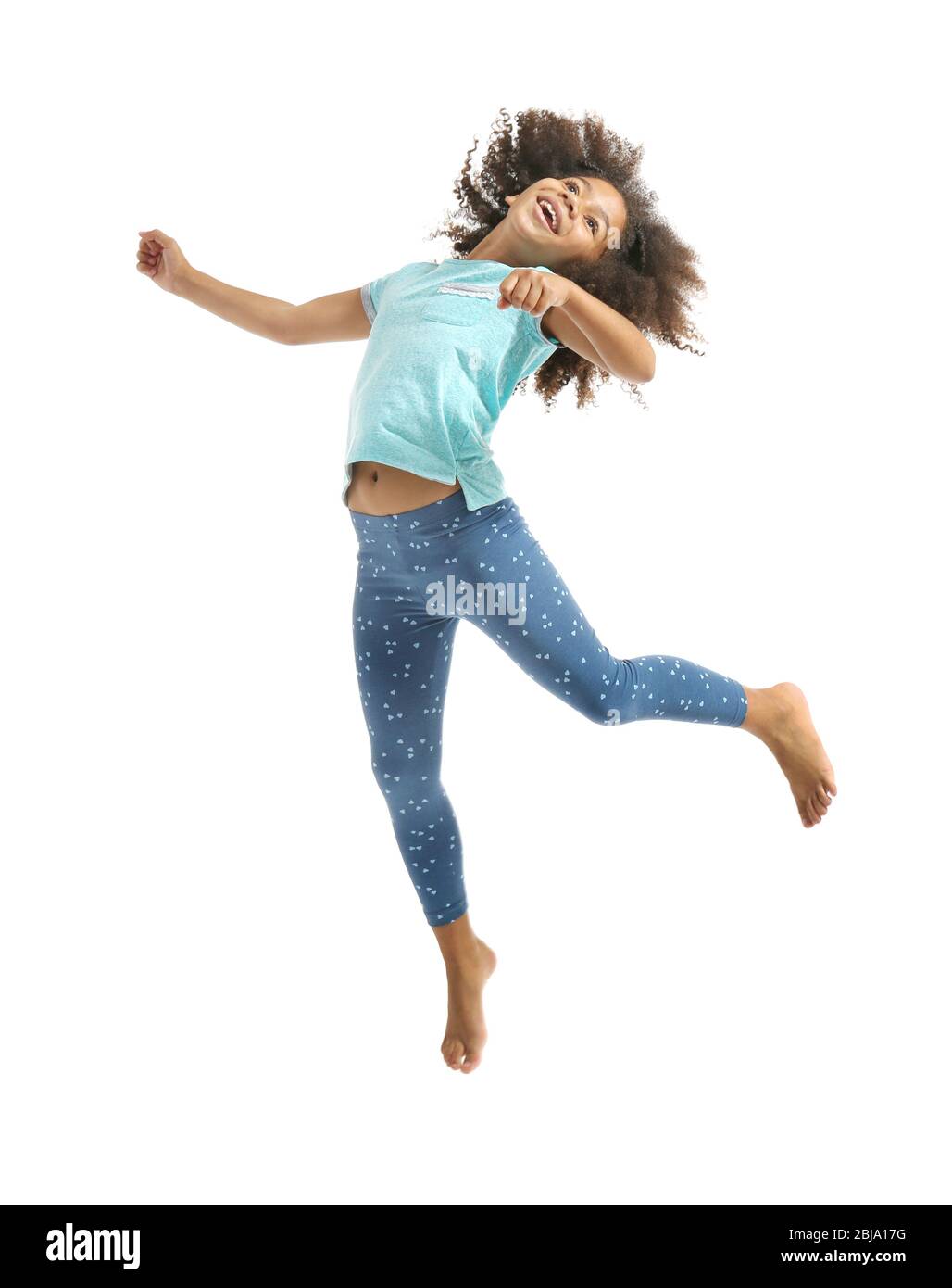 Happy African girl jumping, isolated on white Stock Photo - Alamy