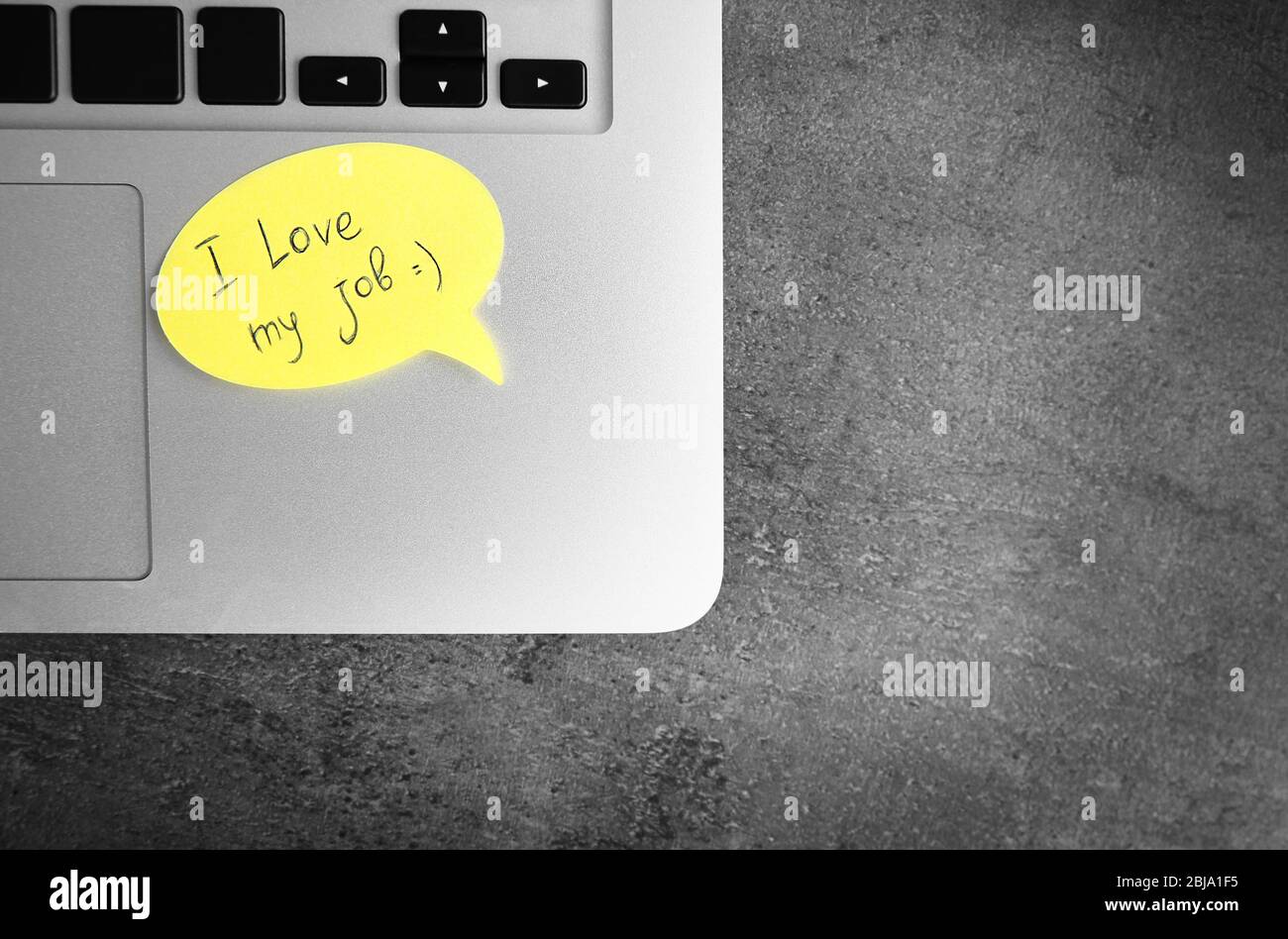 I love my job concept. Laptop with yellow sticker Stock Photo - Alamy