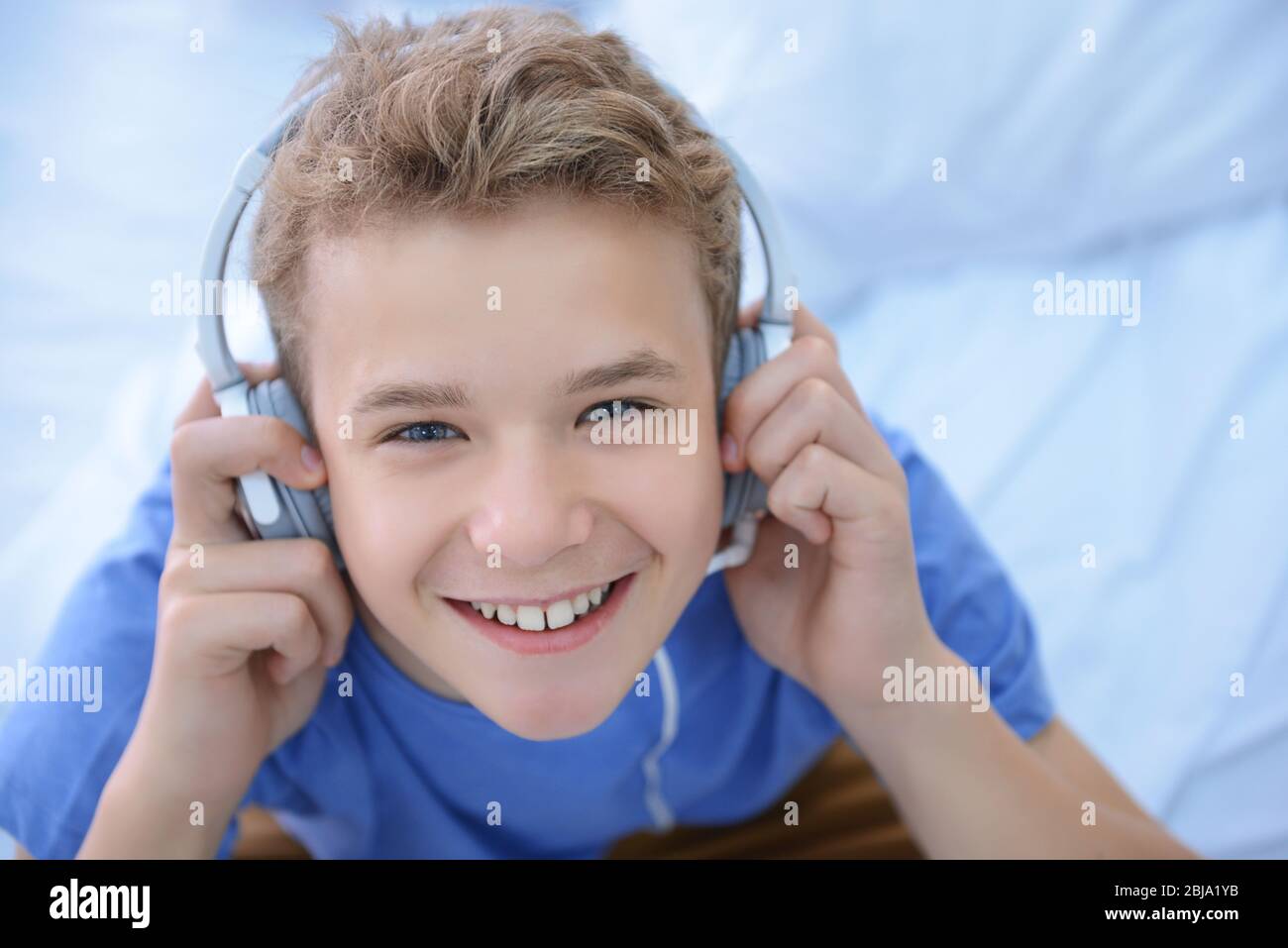 Boy listening music, closeup Stock Photo - Alamy