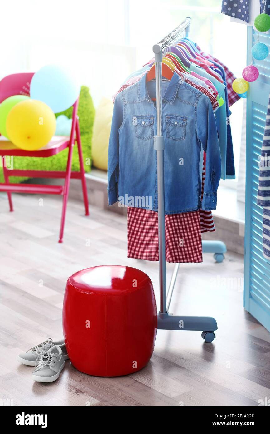Children clothes hanging on hangers in the shop Stock Photo - Alamy