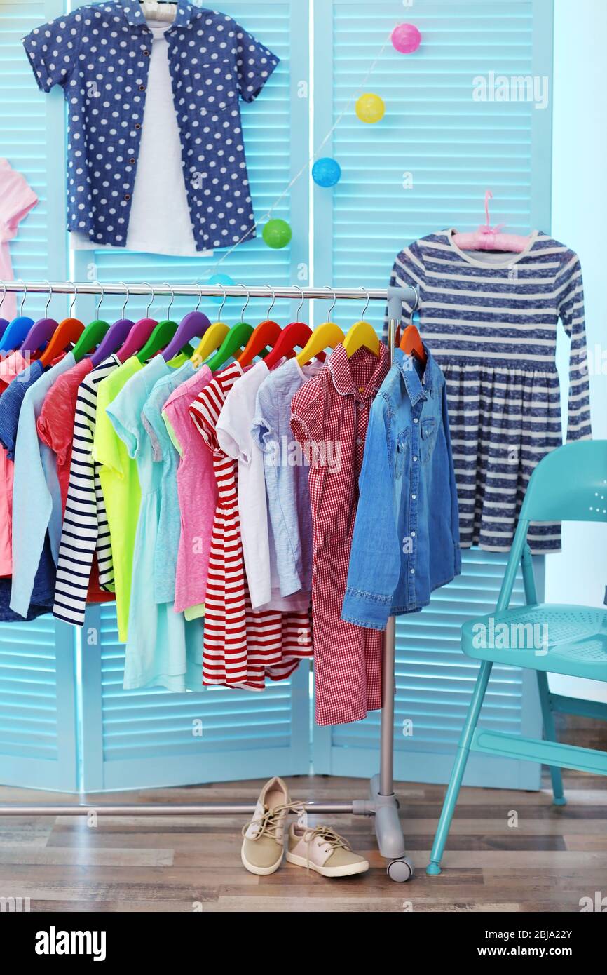 Children clothes hanging on hangers in the shop Stock Photo - Alamy