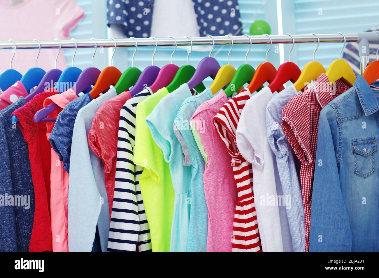 Children clothes hanging on hangers in the shop Stock Photo - Alamy
