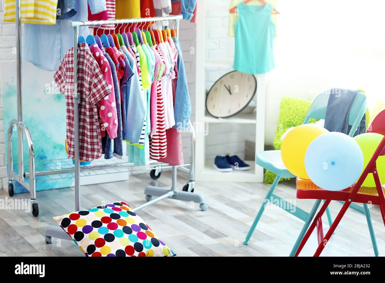 Children clothes hanging on hangers in the shop Stock Photo - Alamy