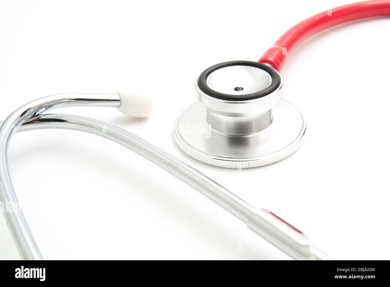 Close -up red stethoscope on white background Stock Photo - Alamy