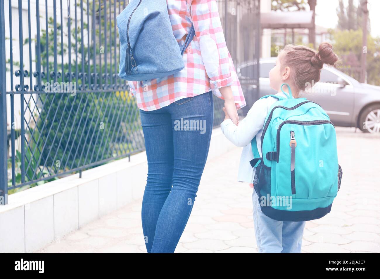 Parent taking child to school Stock Photo - Alamy