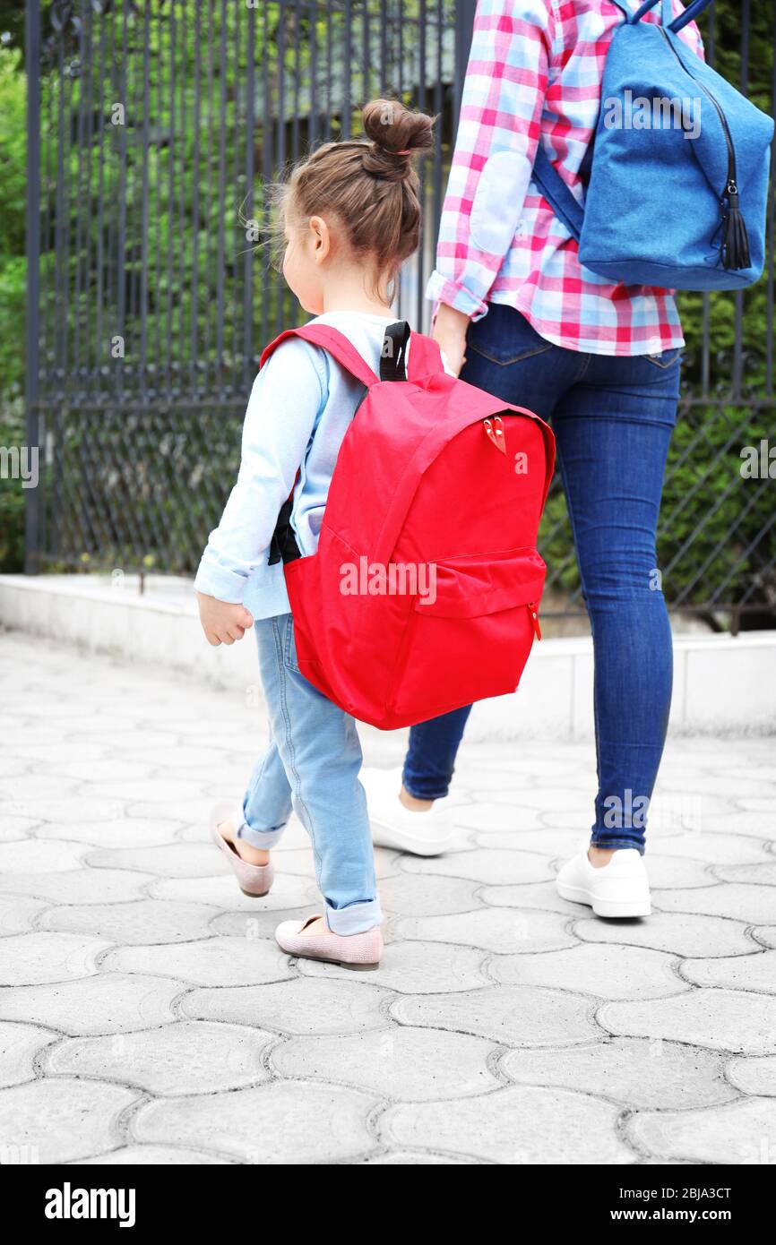 Parent taking child to school Stock Photo - Alamy