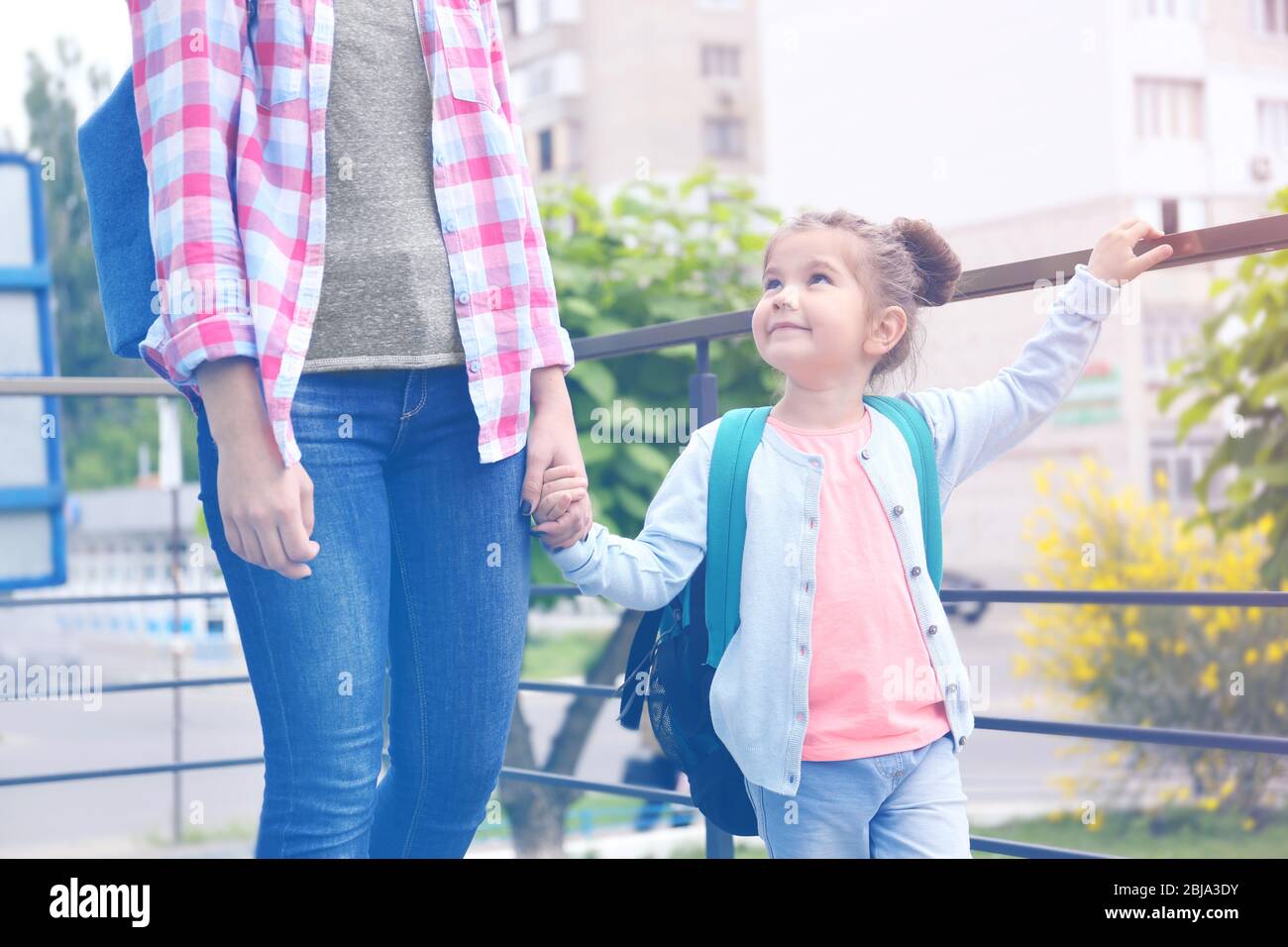 Parent taking child to school Stock Photo - Alamy