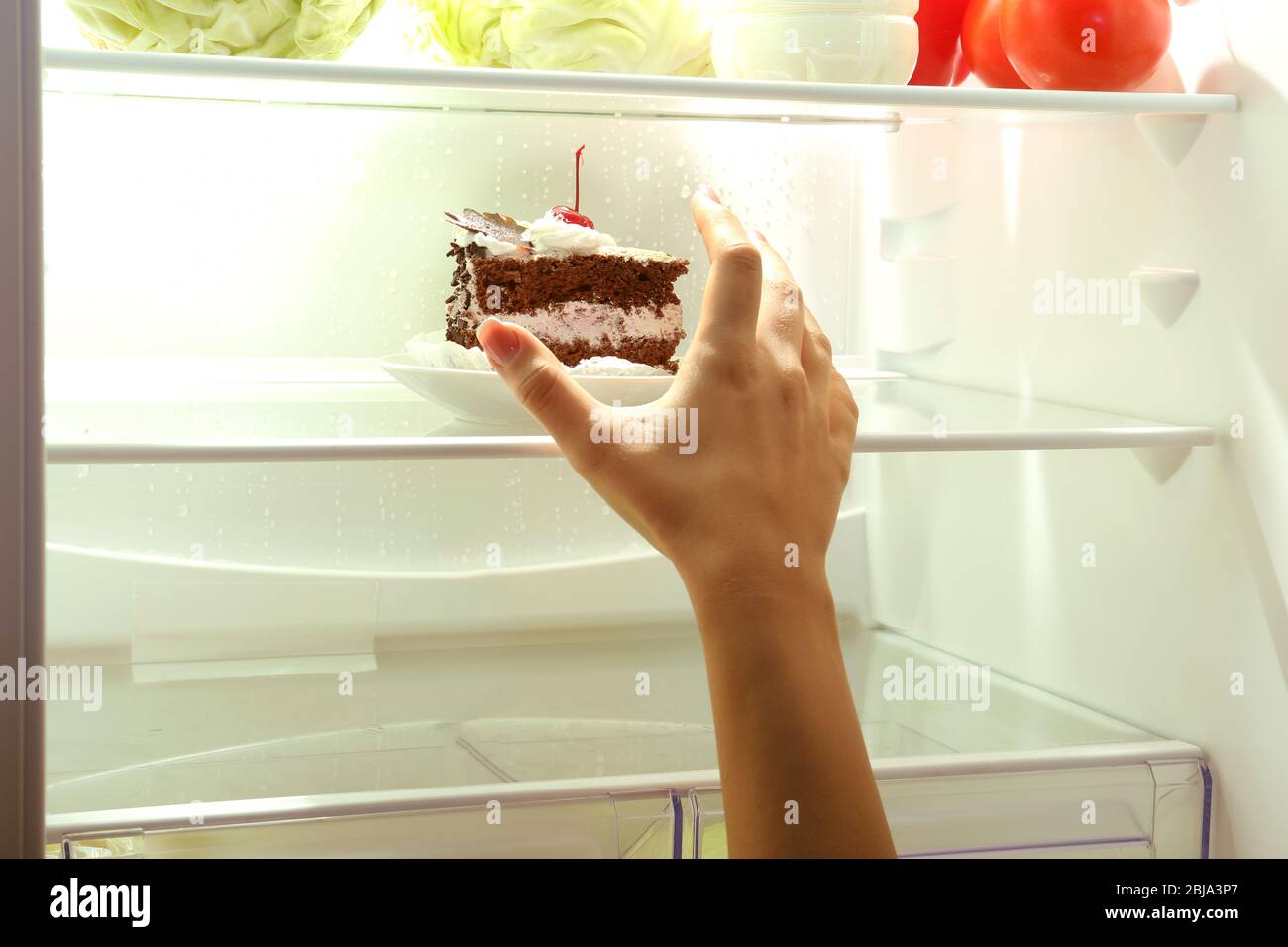 Hand reaching cake hi-res stock photography and images - Alamy